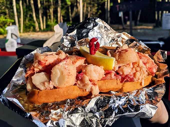 Behold the lobster roll in its natural habitat: overflowing with sweet meat and ready to make your taste buds very, very happy.