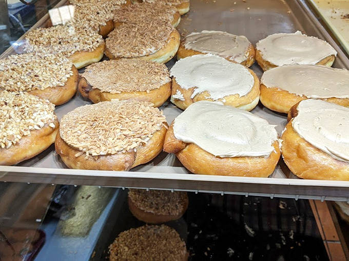 These caramel-frosted donuts with their generous sprinkling of chopped nuts aren't just treats – they're edible works of art that disappear all too quickly.