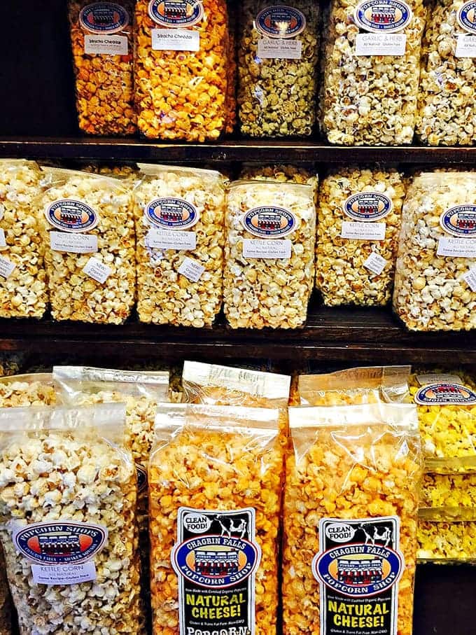 Popcorn varieties stacked like edible building blocks, each bag a different adventure waiting to happen at home.