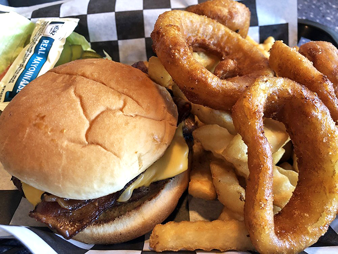 This isn't just any cheeseburger &ndash; it's a juicy patty with melted cheese that pairs perfectly with those crispy onion rings and fries.