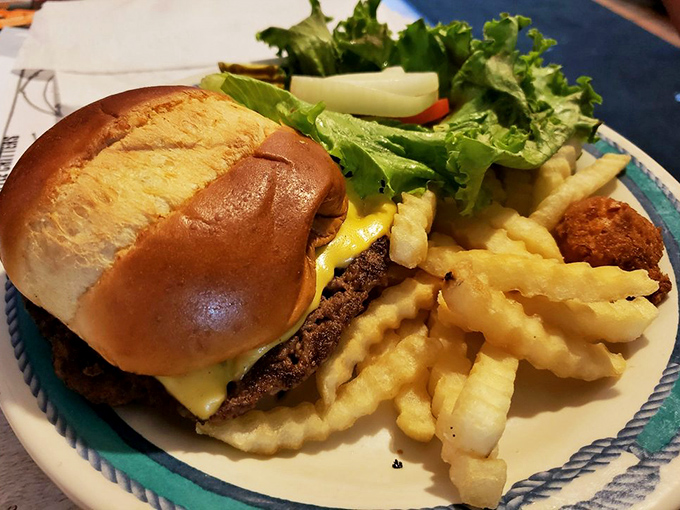 Even landlubbers find their happy place with this perfectly charred patty on a golden bun, accompanied by crispy waffle fries.