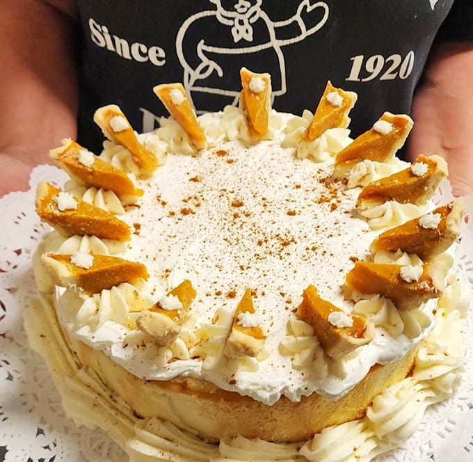 Their signature cheesecake wears a crown of cookie pieces like a dessert royalty, proving that sometimes the simplest decorations make the most elegant statement.