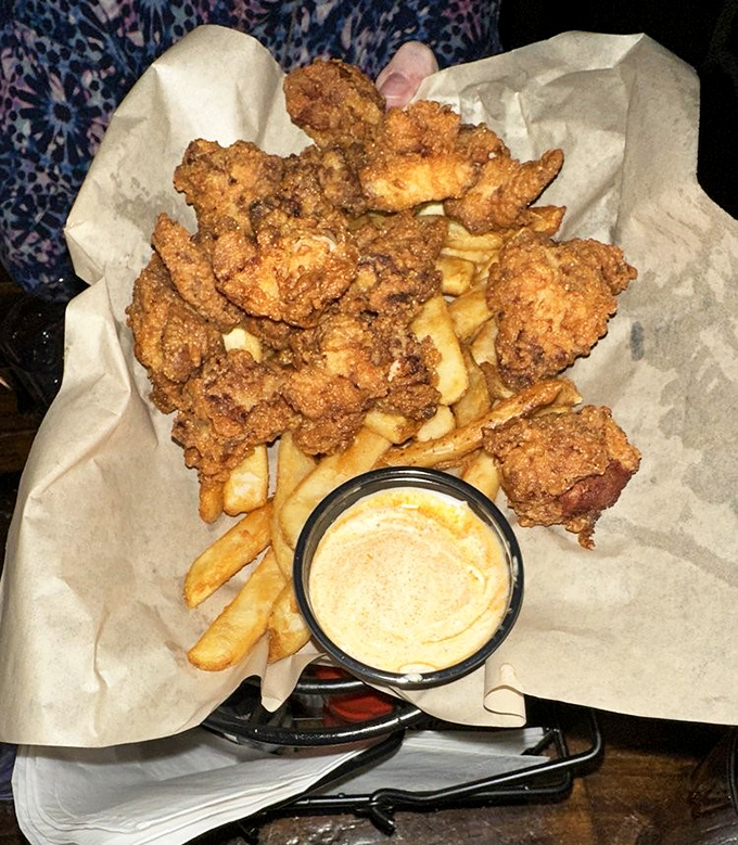 Golden-brown chicken tenders nestled alongside crispy fries, proof that childhood favorites can grow up without losing their soul.