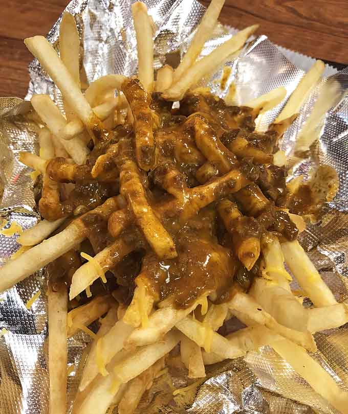 Hot Dog Bun: A Chicago-style masterpiece where every garden ingredient finds its perfect place &ndash; proof that vegetables can indeed improve a hot dog.