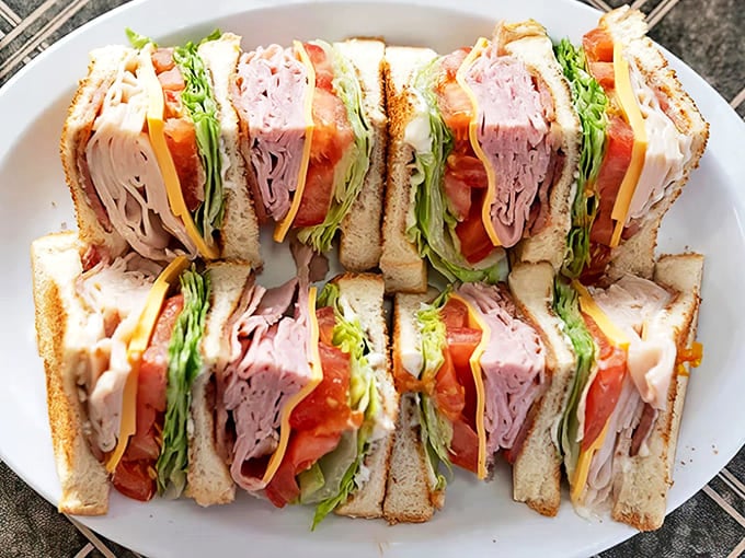 Layer upon layer of fresh ingredients stacked between toasted bread &ndash; this club sandwich is architectural brilliance you can actually eat.