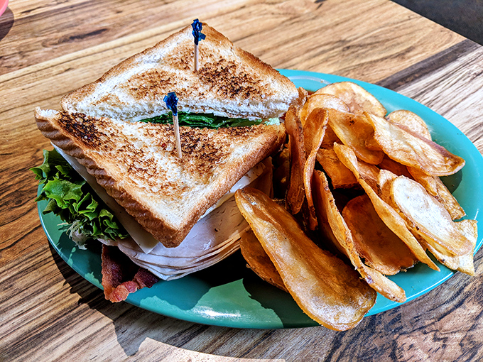 This isn't just a sandwich &ndash; it's architectural genius with layers of flavor between perfectly toasted bread and homemade chips.