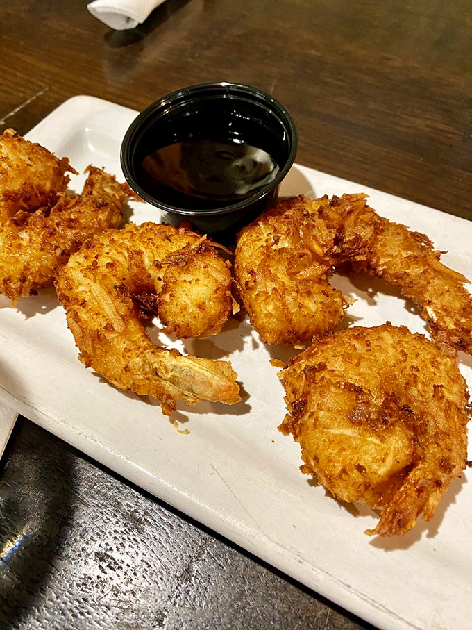 Tropical paradise meets Midwest charm. These coconut shrimp are crunchy, juicy, and paired with a raspberry sauce that'll make your taste buds do the hula.