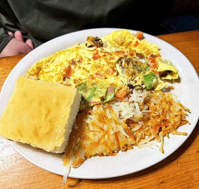 This breakfast plate means business, with eggs, hash browns, and a biscuit ready to fuel your entire day of adventure.