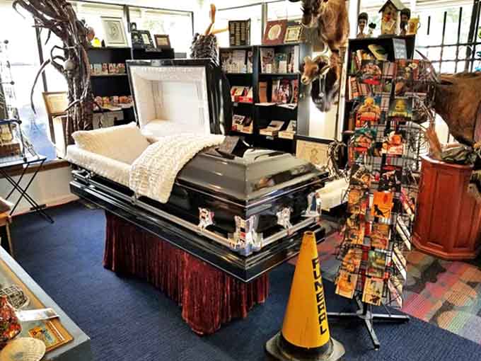 Coffin: This gleaming casket, lined with pristine fabric, offers a strangely inviting glimpse into our final resting place &ndash; the Cadillac of eternal slumber.