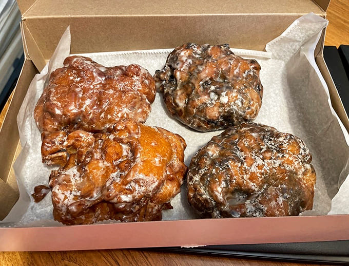 A box of fritters showcasing the generous size and golden perfection that's made Congdon's famous across New England.