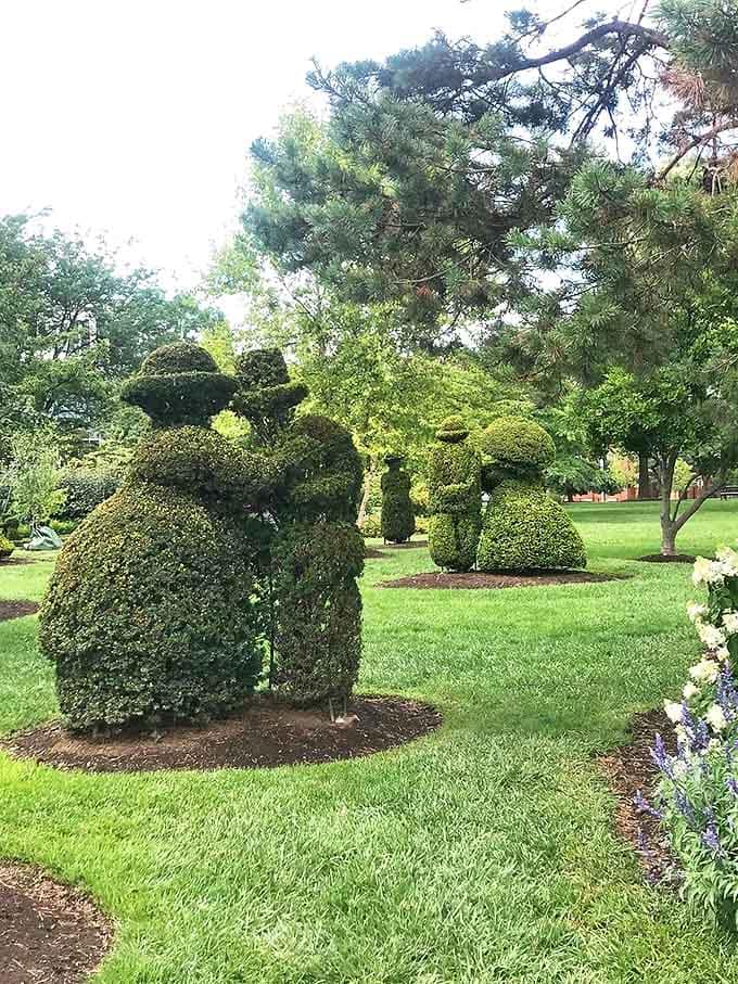 Romance blooms eternally in this leafy couple, forever caught in a moment of Victorian courtship among the greenery.