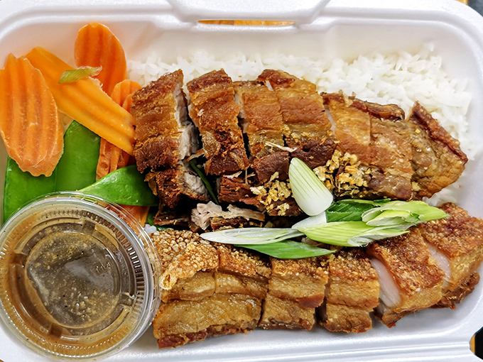 The crispy pork belly arrives like edible architecture &ndash; layers of flavor and texture that collapse beautifully with each bite.