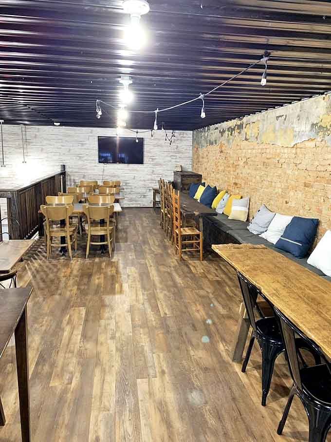 Wooden tables, cozy benches, and string lights create the perfect backdrop for conversations that linger longer than planned.