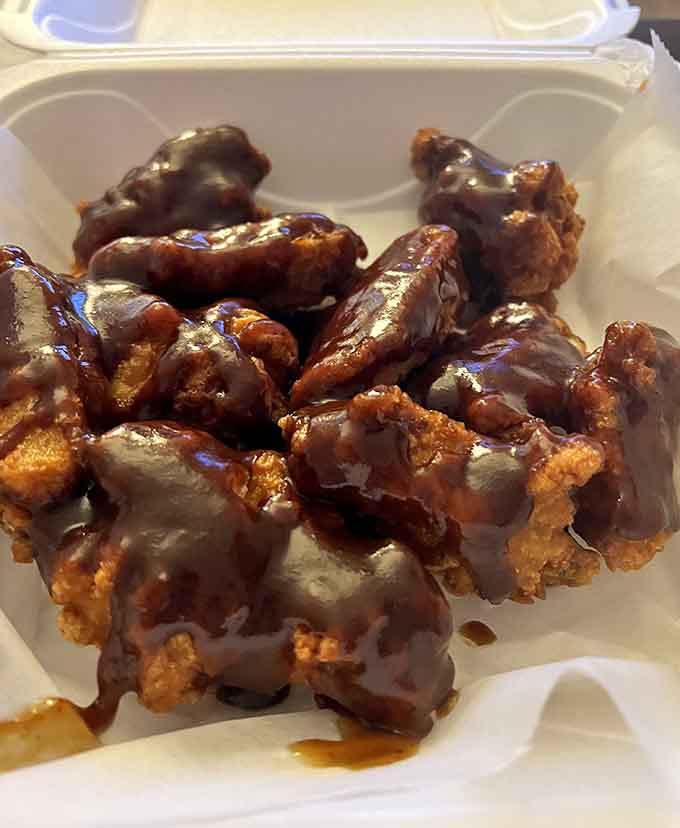 The darker side of wing perfection, possibly teriyaki or barbecue, proving variety is indeed the spice of poultry life.