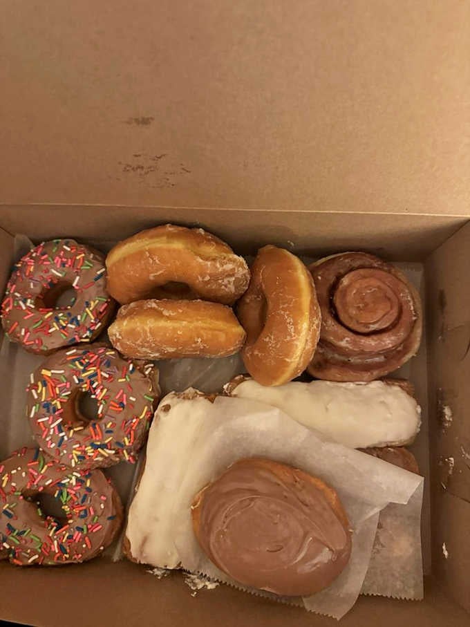 Donut heaven awaits with colorful frosted creations that make choosing just one an exercise in delicious indecision.