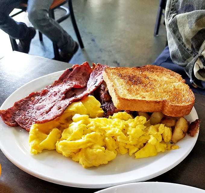 House-made corned beef hash with perfectly cooked eggs &ndash; the dish that launches a thousand return visits and zero regrets.