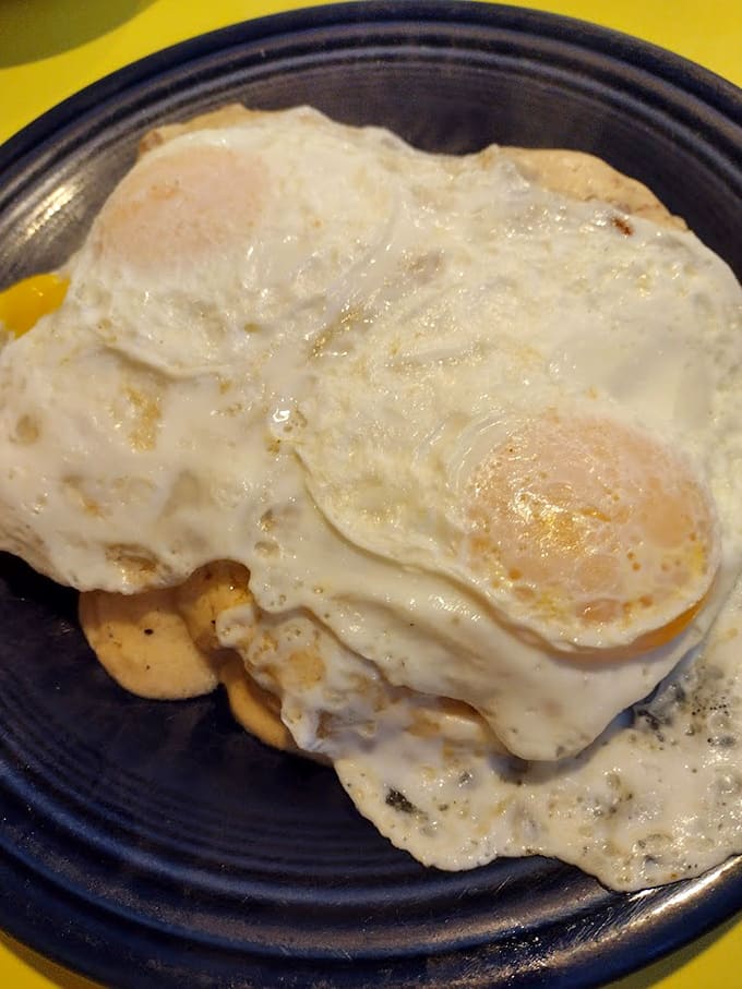 When that perfectly cooked egg joins the gravy party, you're witnessing breakfast alchemy that would make scientists weep with joy and confusion.