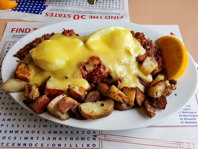 When corned beef hash meets eggs Benedict, magic happens – a golden cascade of hollandaise sauce elevating an already perfect breakfast.