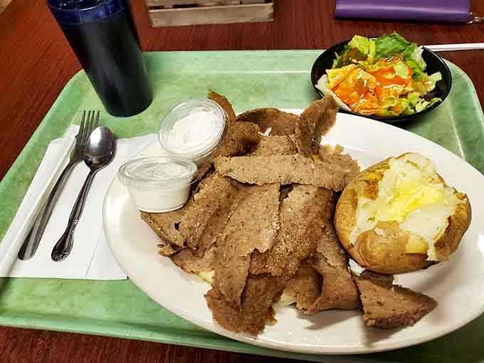 This gyro plate showcases the star attraction: tender, crispy-edged meat that's converted countless steakhouse skeptics into believers.