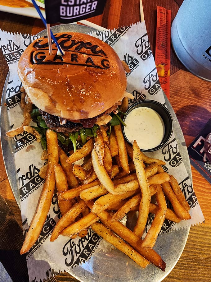 The perfect burger doesn't exi&mdash; wait, it does! Juicy perfection on a brioche bun with golden fries standing at attention, ready for their dipping destiny.