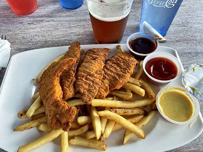 Golden fried fish and chips that prove sometimes the classics become classics for very good reasons, crispy perfection achieved.