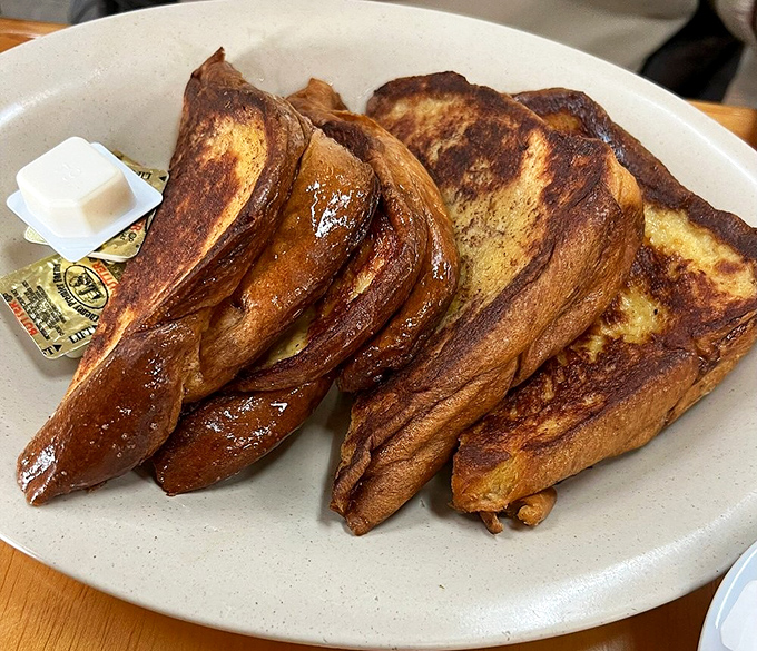 Breakfast royalty on a plate! Perfectly caramelized edges give way to a custardy interior that makes ordinary toast weep with jealousy.