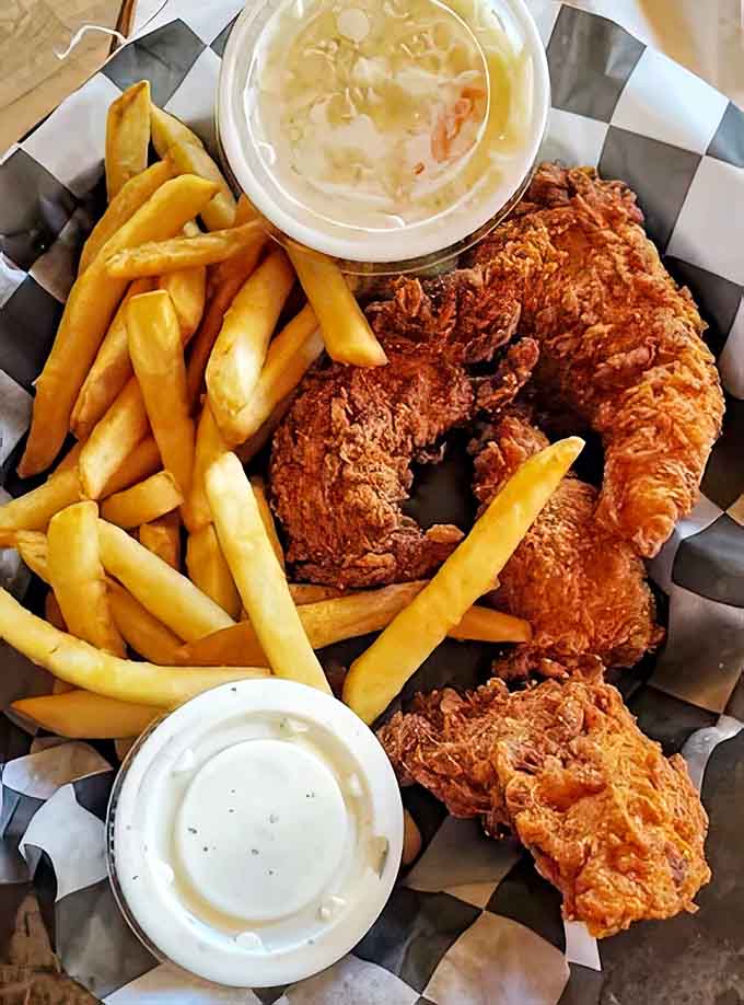Golden-fried chicken that's somehow both impossibly crispy outside and juicy inside – the culinary equivalent of hitting the jackpot.
