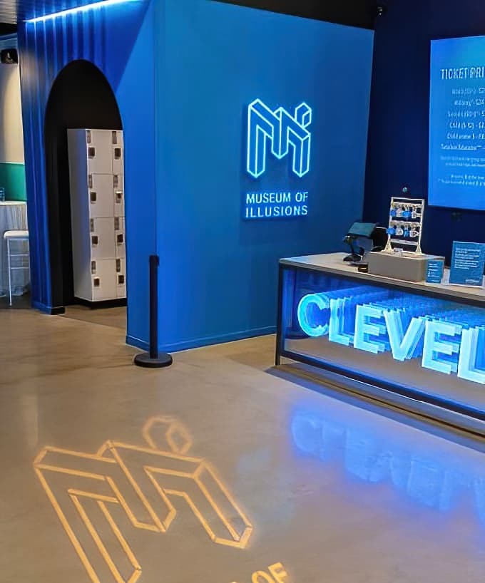 The glowing "CLEVELAND" reception area welcomes visitors with a hint of the visual trickery that awaits throughout the museum.