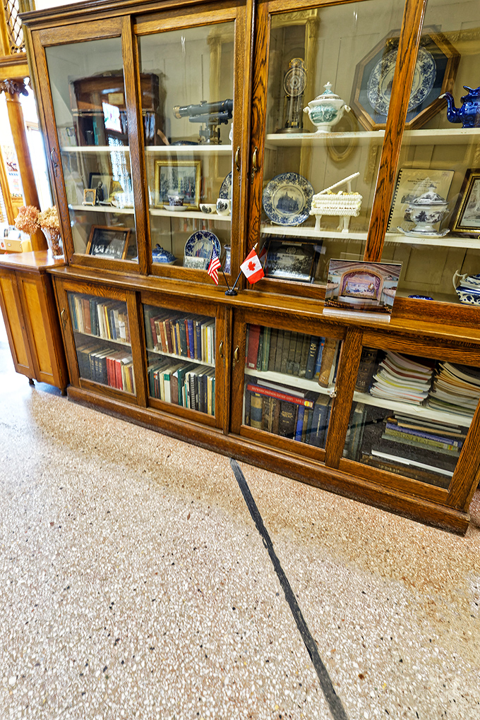 Glass Display Cabinet: Treasures behind glass tell tales of two nations' shared history, delicate artifacts preserved like memories of a time before borders mattered.