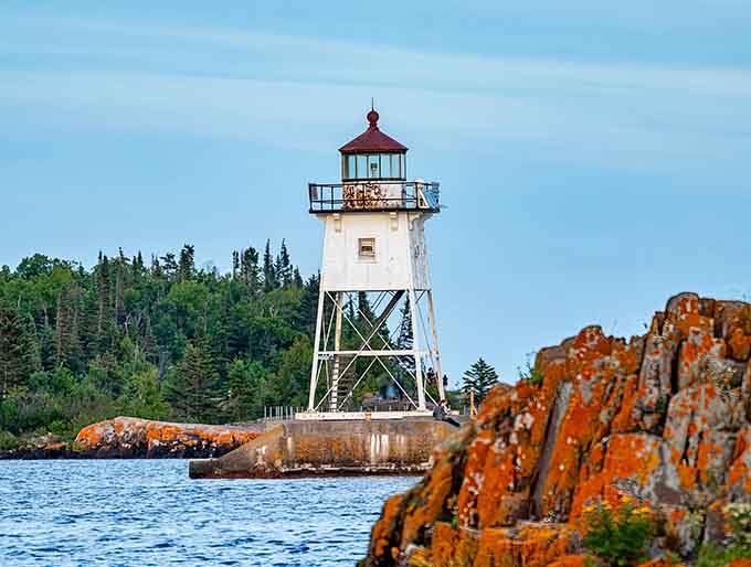 The Grand Marais Lighthouse stands watch over the harbor, a modest beacon that's been guiding boats home for generations of grateful sailors.