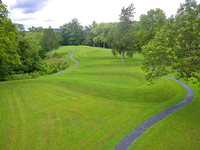 Great Serpent Mound: Ancient earthworks wind through verdant hills, a prehistoric mystery that still whispers secrets to those who walk its carefully crafted paths.