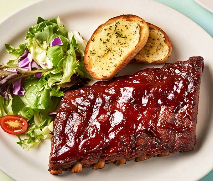 Behold the rib rack that launched a thousand return visits, glazed to sticky perfection and ready for action.