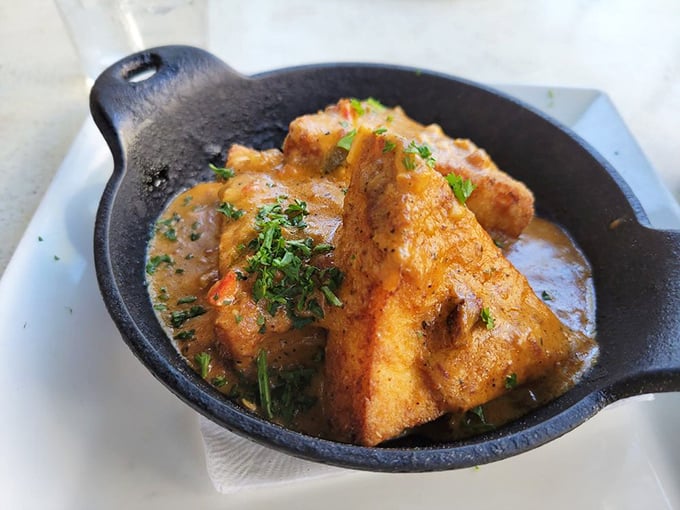 These cornmeal-crusted grit cakes swimming in savory sauce might make you reconsider your life choices &ndash; why haven't you been eating these daily?