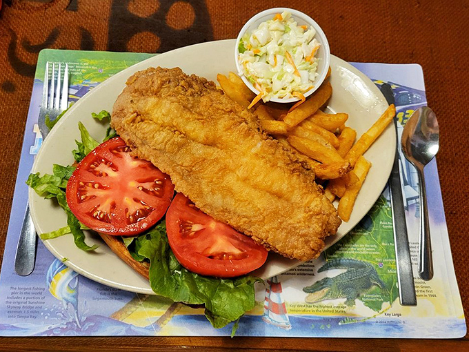 A masterpiece of fresh Florida seafood &ndash; this mammoth sandwich features perfectly cooked grouper nestled between garden-fresh toppings on a pillowy bun.