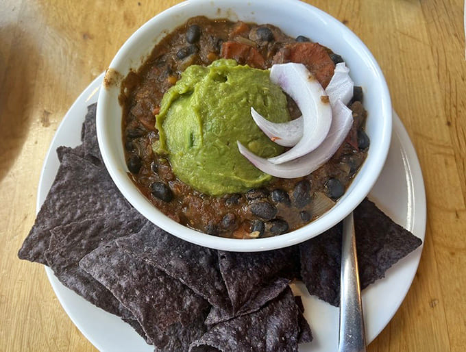 Even the vegan chili gets star treatment here, topped with vibrant guacamole and served with crispy tortilla chips for scooping.