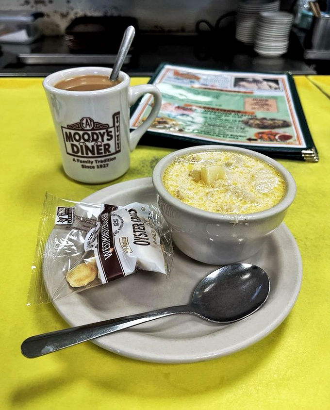 A perfectly brewed cup of coffee in a classic Moody's mug, the ideal companion for watching the world go by.