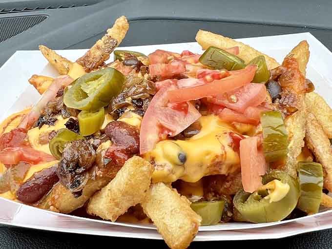 Loaded fries topped with cheese, peppers, and all the fixings turn a simple side into main event material.