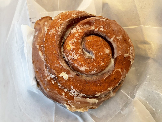 The honey bun glistens with sweet promise &ndash; a spiral of happiness that's been perfected over decades of dedicated baking.