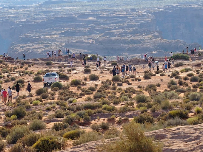 The edge of amazement - visitors gather at the canyon rim, where a thousand-foot drop meets million-dollar views.