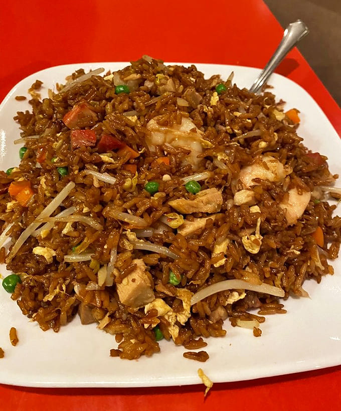 Chicken fried rice done right means every grain stands alone, tossed with vegetables and protein in a dish that's never greasy or boring.