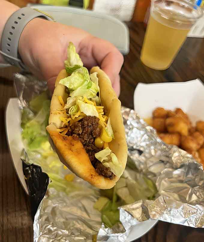 This close-up shows exactly why frybread makes such a perfect taco foundation, soft yet sturdy, ready for its delicious cargo.