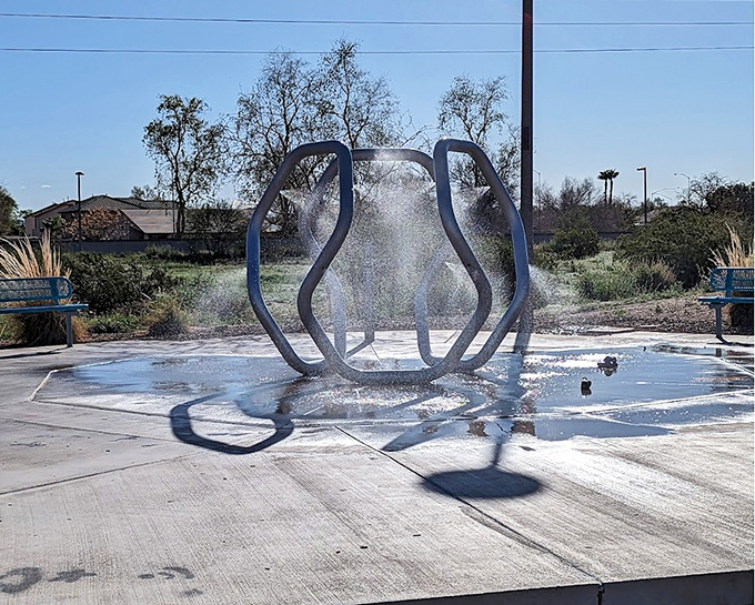 Arizona summers meet their match at this artistic splash pad, where geometric water jets create refreshing fun amid desert heat.