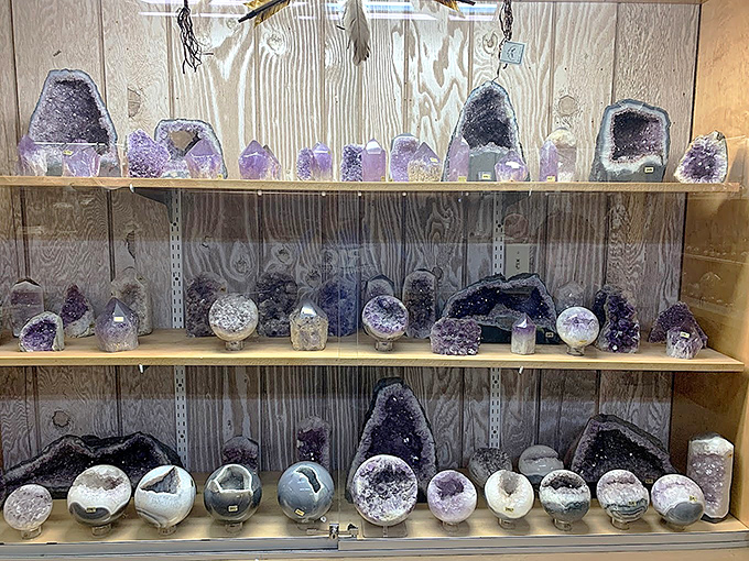 Purple kingdoms in miniature: amethyst geodes split open to reveal their crystalline cathedrals within.