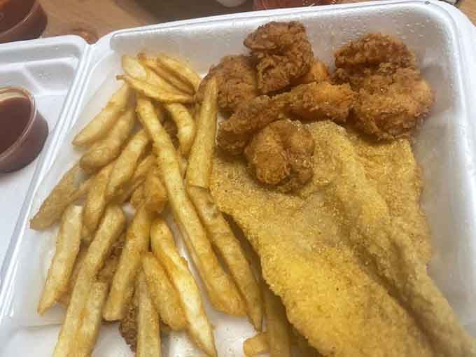 That's what happens when catfish and shrimp get the royal treatment, emerging from the fryer like edible gold that's still too hot to eat but impossible to resist.