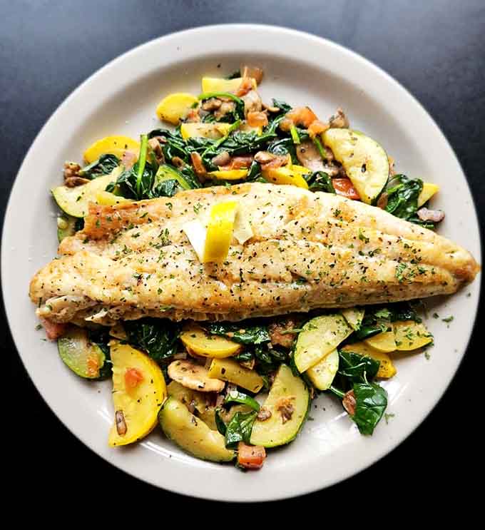 Pan-seared walleye with vegetables that actually look appetizing, proving that healthy eating doesn't have to mean sacrificing flavor or fun.