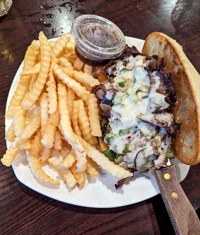 That Philly cheesesteak looks like it could solve all of life's problems, one melty, meaty bite at a time.