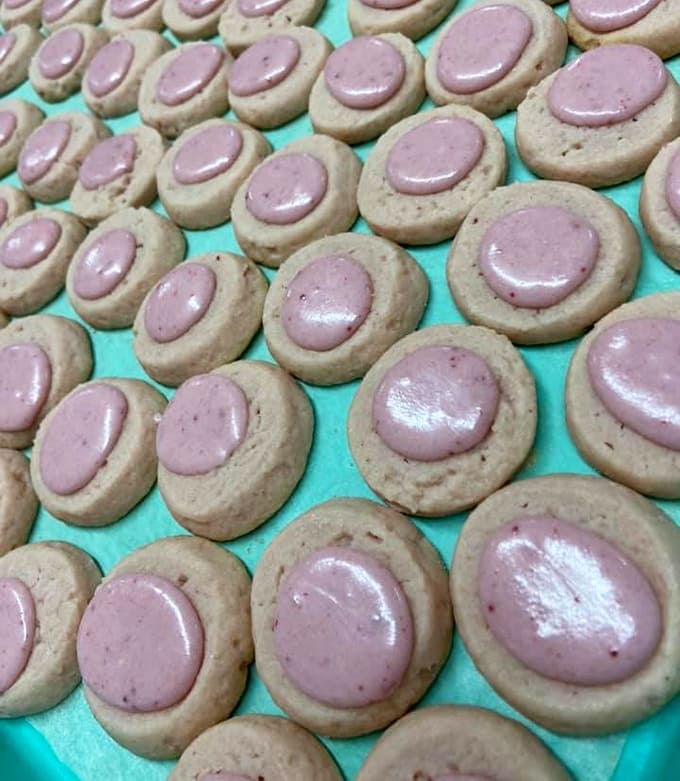 Strawberry-topped tea cookies in perfect pink rows demonstrate that sometimes the prettiest things in life also happen to be the tastiest, which seems almost unfair.