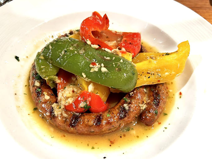 That sausage topped with colorful peppers proves vegetables can be just as exciting as the main event.
