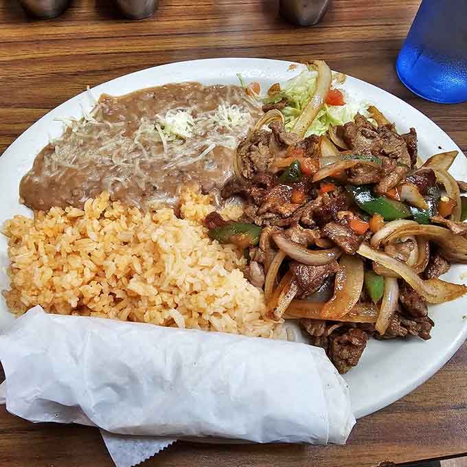 When your combo plate arrives looking like this, you know you're in for a serious eating session that requires strategic planning and loose pants.