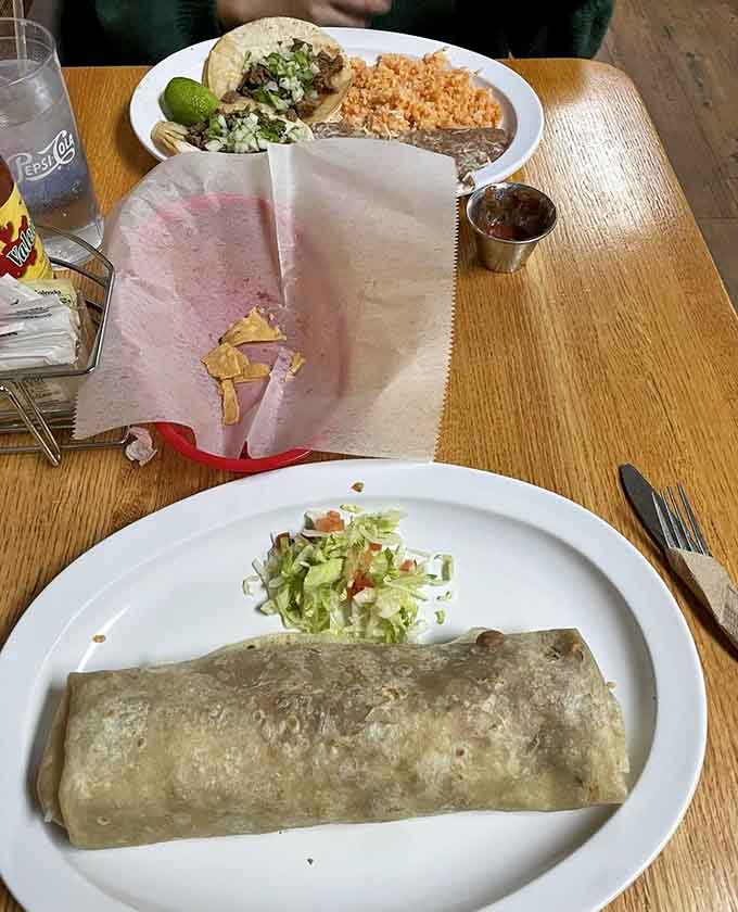 The carne asada burrito arrives like a delicious challenge, packed with tender grilled steak and all the fixings your heart desires.